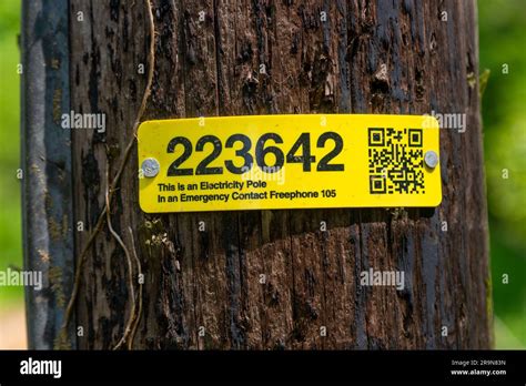 Yellow Identification Tag Label With Reference Number On Electricity