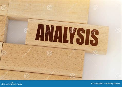 There Is A Wooden Jenga On The Table On One Jenga It Is Written