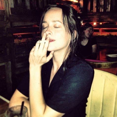 Dakota Johnson Smoking In Restaurant With Eyes Closed No Makeup Black