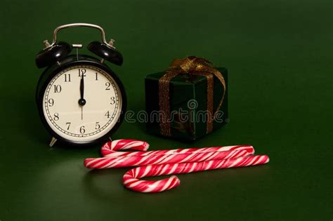 Close Up Of Black Alarm Clock With Midnight On The Dial Sweet Striped