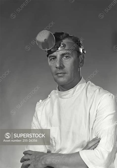 Vintage Photograph Portrait Of A Male Doctor Wearing A Headlamp