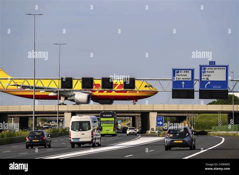 Amsterdam Schiphol Airport Dhl Cargo Aircraft On The Taxiway Bridge