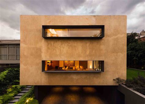 Andres Stebelski Elevates Boxy Clay Covered House Above Parking Spot In