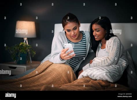 Do You Think Thats His New Girlfriend A Young Woman Showing Her Friend