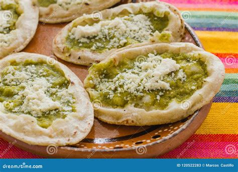 Mexican Sopes With Grated Cheese And Green Salsa Mexican Food Spicy In