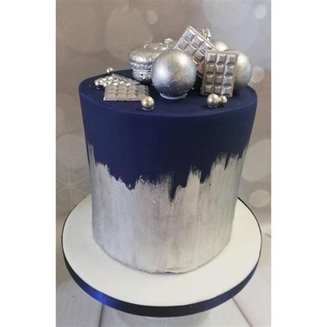 Lovely Silver And Navy Blue Birthday Cake With Chocolate Bars And Macarons