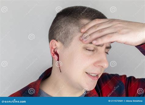 A Man Whose Ear Is Bleeding Vascular Rupture Damage To The Tympanic