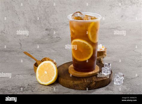 Sweet Lemonade Tea In Plastic Cup With Iced On Texture Background Summers Refreshment Stock