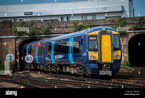 Class 375 Passenger Train In Southeastern Livery Travelling Past