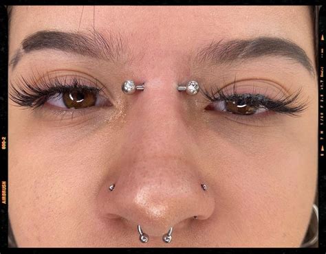 Nose Bridge Piercing Bridge Piercings 101 The Cost Aftercare And