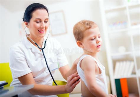 Happy Little Boy At The Doctor For A Checkup Stock Image Image Of