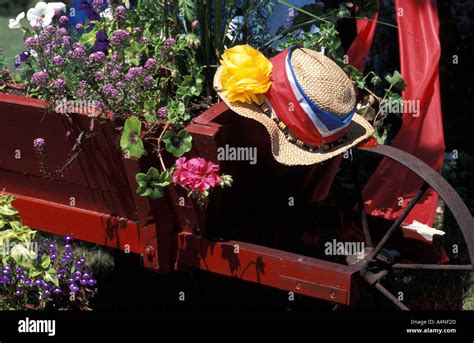Acadian Culture Showing In The Colour Of The Wheelbarrow And The Bonnet