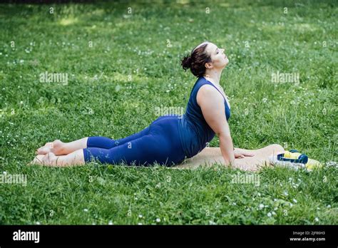 Happy Confident Smiling Plus Size Curvy Woman Doing Yoga Stretching Pilates Workout Exercising Happy Confident Smiling Plus Size Curvy Woman Doing Yoga Stretching Pilates Workout Exercising