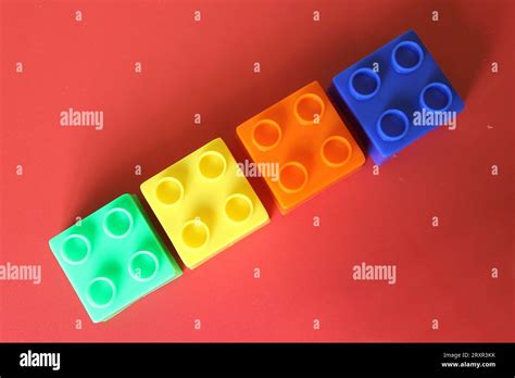 Buildable Colored Plastic Blocks To Play Build And Organize On A Red