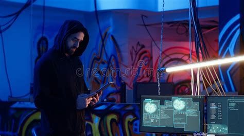 Lone Wolf Hacker In Hideout Trying To Avoid Being Detected Using Tablet Stock Image Image Of
