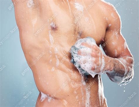 Closeup Of Man In The Shower Man Rubbing Soap On His Stomach Naked