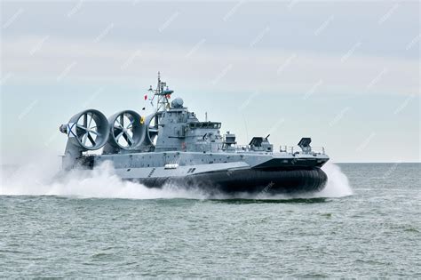 Premium Photo Hovercraft Warship Armed With Armament Sails Into Sea Toward Military Target To