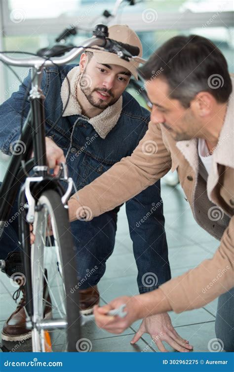 Man Fixing Bicycle Wheel With Spanner Stock Image Image Of Worker