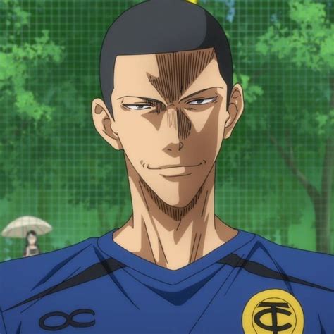 An Anime Character Wearing A Blue Shirt With Yellow Circles On His