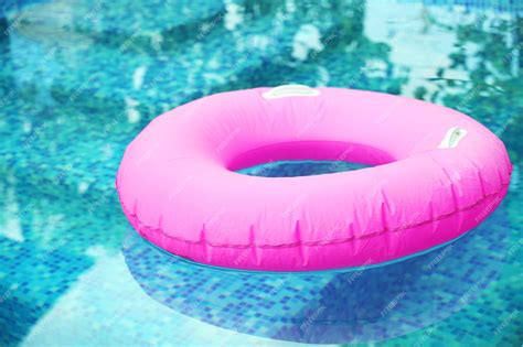 Premium Photo Pink Pool Float Pool Ring In Cool Blue Refreshing Blue Pool