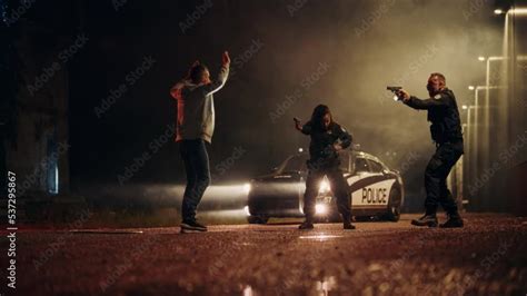 Two Police Officers Catch And Put Suspect Under Arrest Cops Aiming