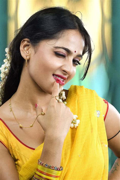 Download Anushka Shetty Yellow Saree Traditional Look Wallpaper
