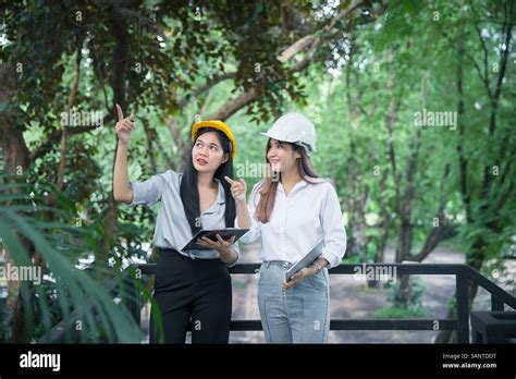 Confident Team Of Female Architect Working Together At Terrace They Discussing About New