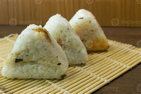 The Japanese Food Onigiri White Rice Formed Into Triangular Or