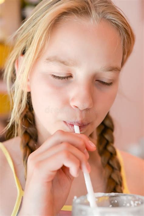 Teen Pretty Girl Eleven Years Old Drinking Strawberry Milkshake Through