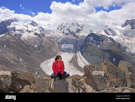 Teenager Tourist Girl Admiring The Snow Covered Swiss Alps Including