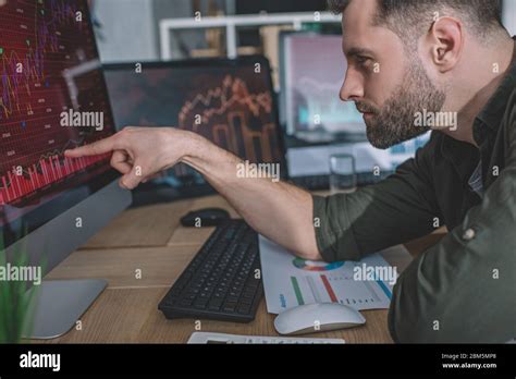 Side View Of Information Security Analyst Pointing With Finger On