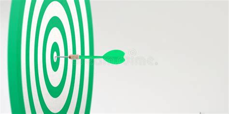 Green Target With A Dart Embedded In The Center Featuring Empty Space