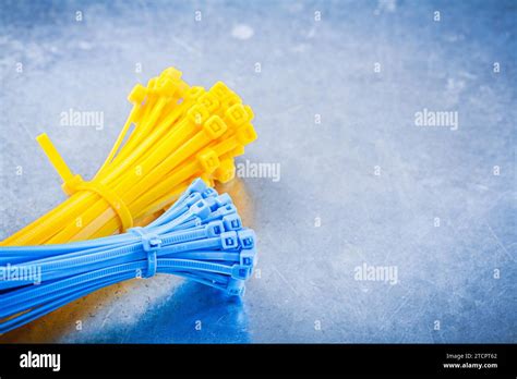 Assortment Of Plastic Binding Cables On A Metallic Background Design