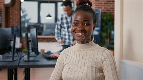 Portrait Of African American Programer Sitting Down Coding On Laptop