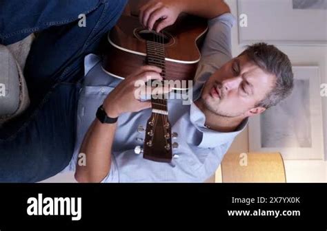 Vertical Video Musical Hobby Guitar Practice Happy Smiling Man