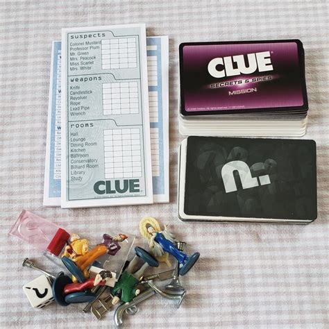 Assorted Clue Game Pieces Suspect Cards Clue Weapons Game Tokens