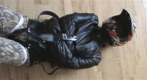 Slave In Leather Straitjacket