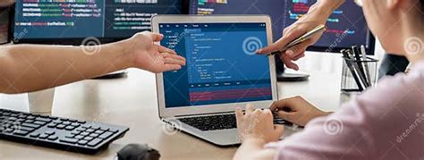 two smart computer engineers working together to solve program code