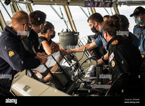 Nicole Robichaud Commanding Officer Of Hmcs Margaret Brooke Foreground Looks On As Bridge