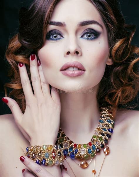 Beauty Rich Woman With Bright Makeup Wearing Luxury Jewellery On Black