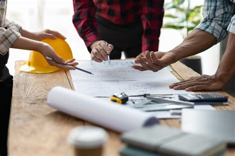 Brainstorming Group Of Architects And Engineers Discuss Building