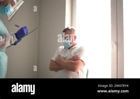 Immunization Procedure The Doctor Fills Out A Questionnaire Or Medical