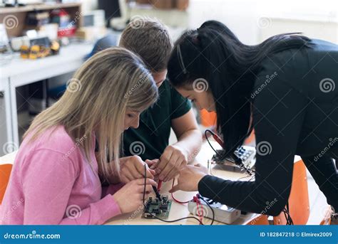 Scientists Engineers Designing Small Human Robot Setting Artificial Intelligence Humanoid Robot