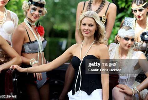 Donna Air Poses For A Photograph With Models Dressed In Lingerie At