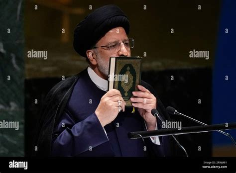 Irans President Ebrahim Raisi Kisses A Quran As He Addresses The 78th