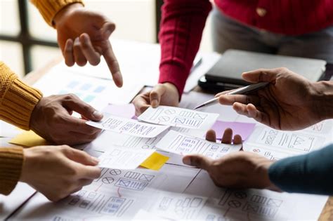 Premium Photo Ux Ui Designers Collaborate To Design User Interfaces For Smartphone Apps Based