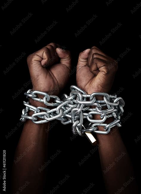 Chain Hands And Prisoner Of Slavery Isolated In Studio On A Black