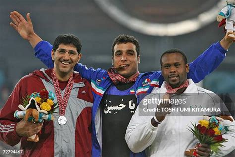 Irans Ehsan Hadadi Poses With Qatars Rashid Shafi B Al Dosari And