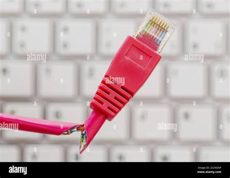 Defective Network Cable On Keyboard Symbolic Photo For Online