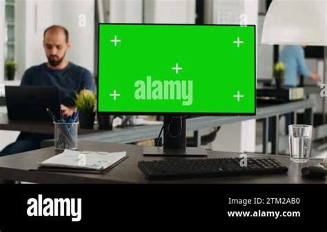 Greenscreen On Computer Desktop At Empty Workstation Pc With Isolated Mockup Template And